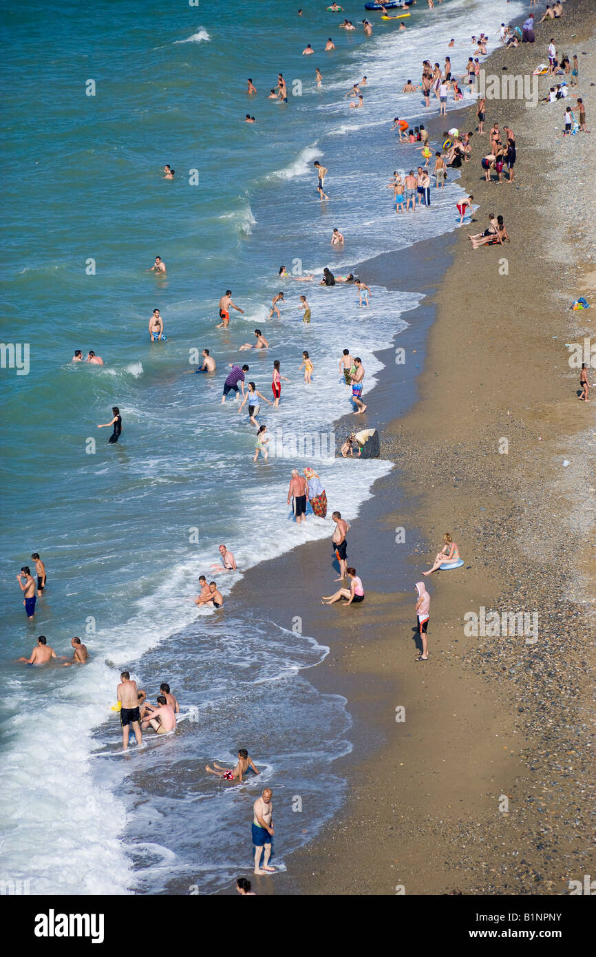 People enjoying the beach and swimming in the sea aerial Agacli Black ...