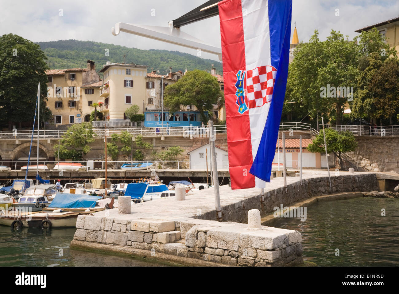 Lovran Istria Croatia Europe Croatian flag flying above jetty in small ...