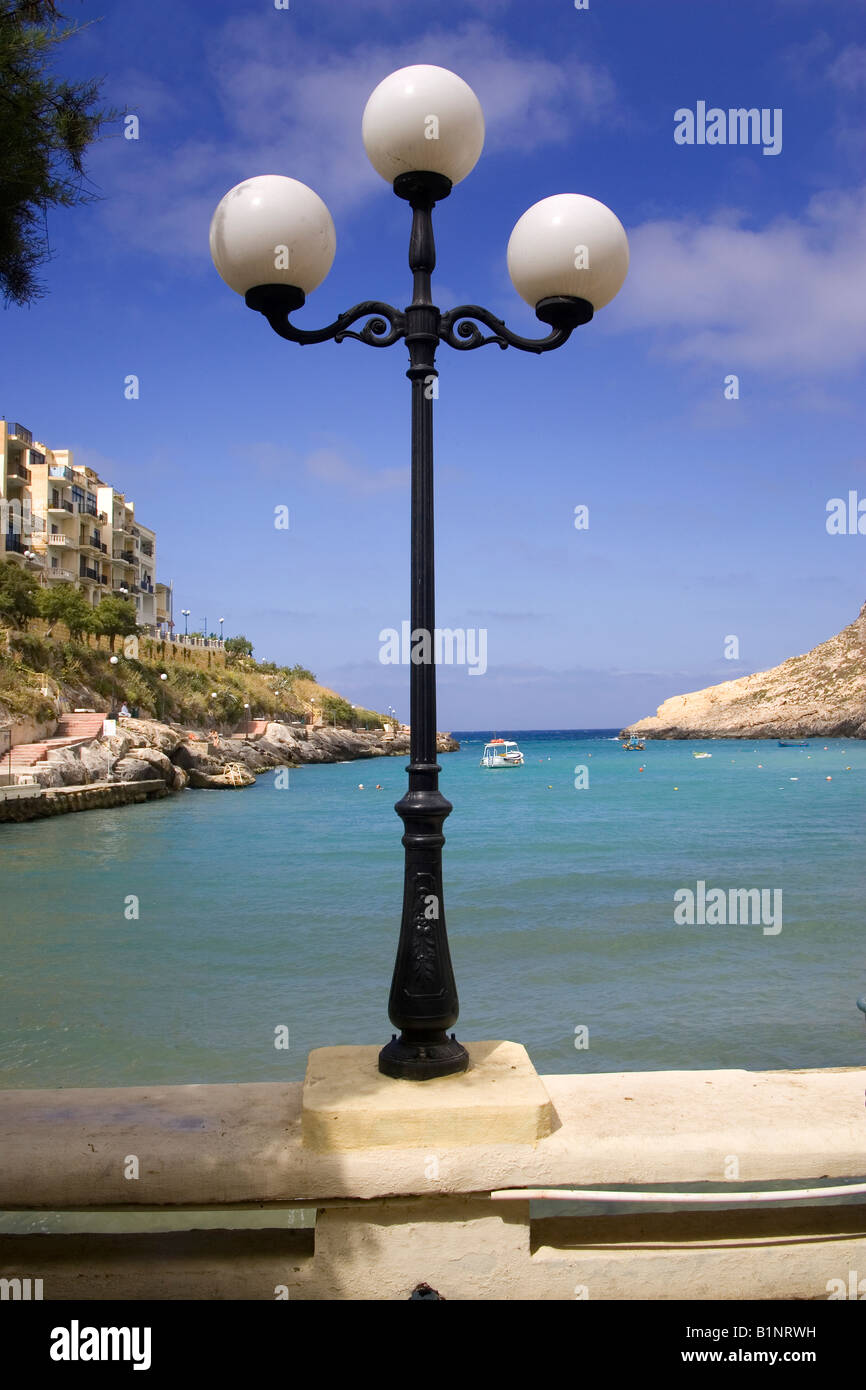 Lamppost on a ledge at the seaside, Xlendi, Gozo, Malta Stock Photo - Alamy