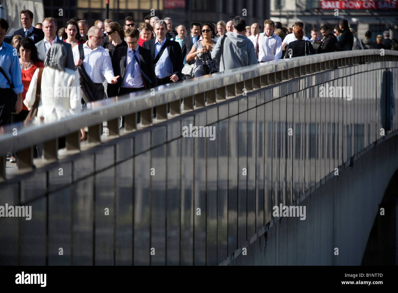 People crossing London bridge at rush hours London England Britain UK ...