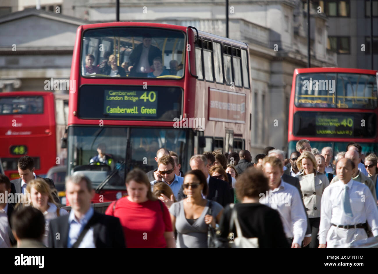 People crossing London bridge at rush hours London England Britain UK ...
