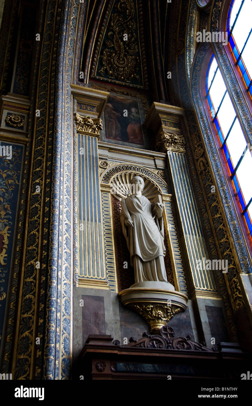 Saint Eustache Cathedral statue in window light, Paris, France Stock ...