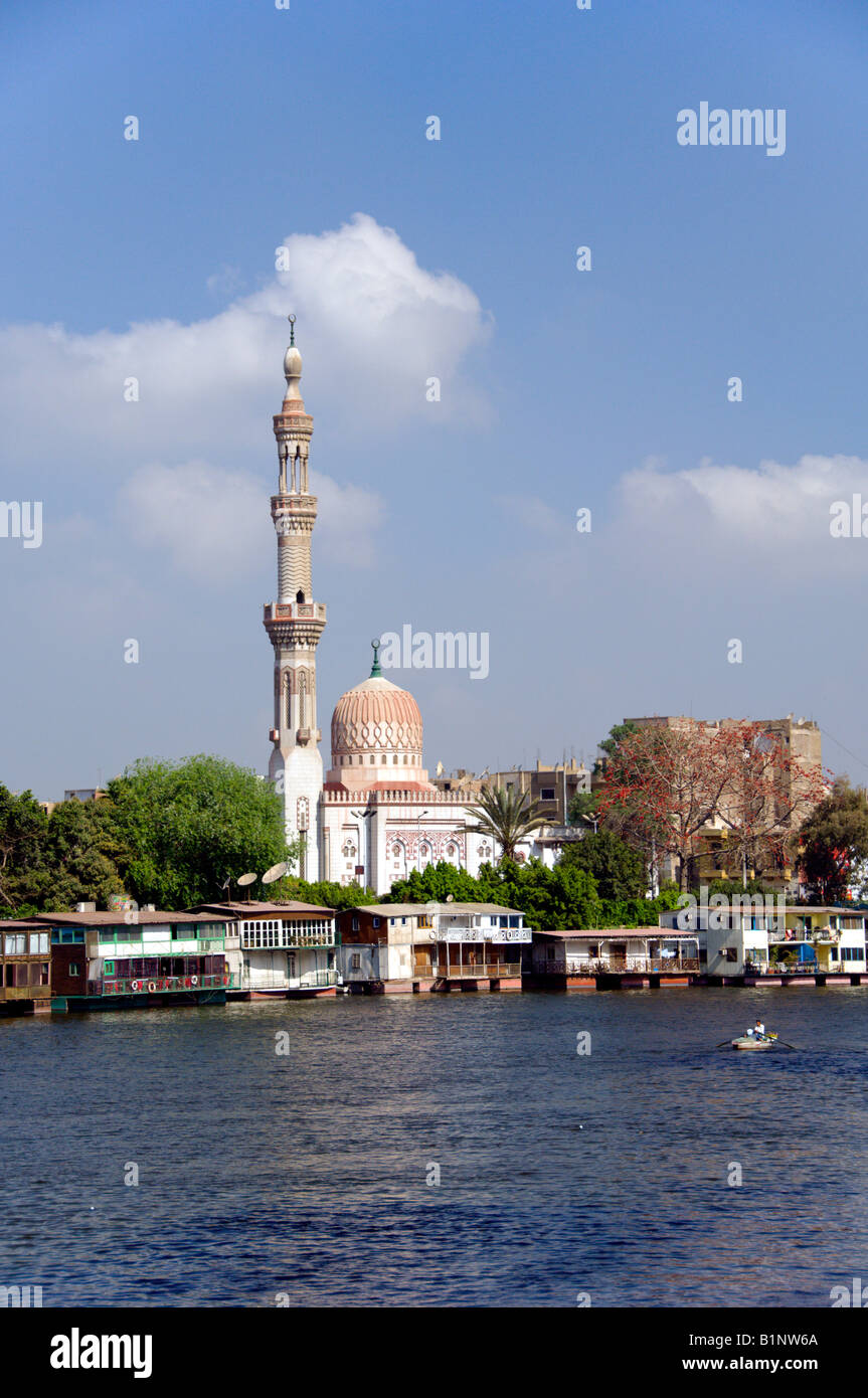 The Nile River with riverboats and a mosque in Cairo Egypt Stock Photo ...