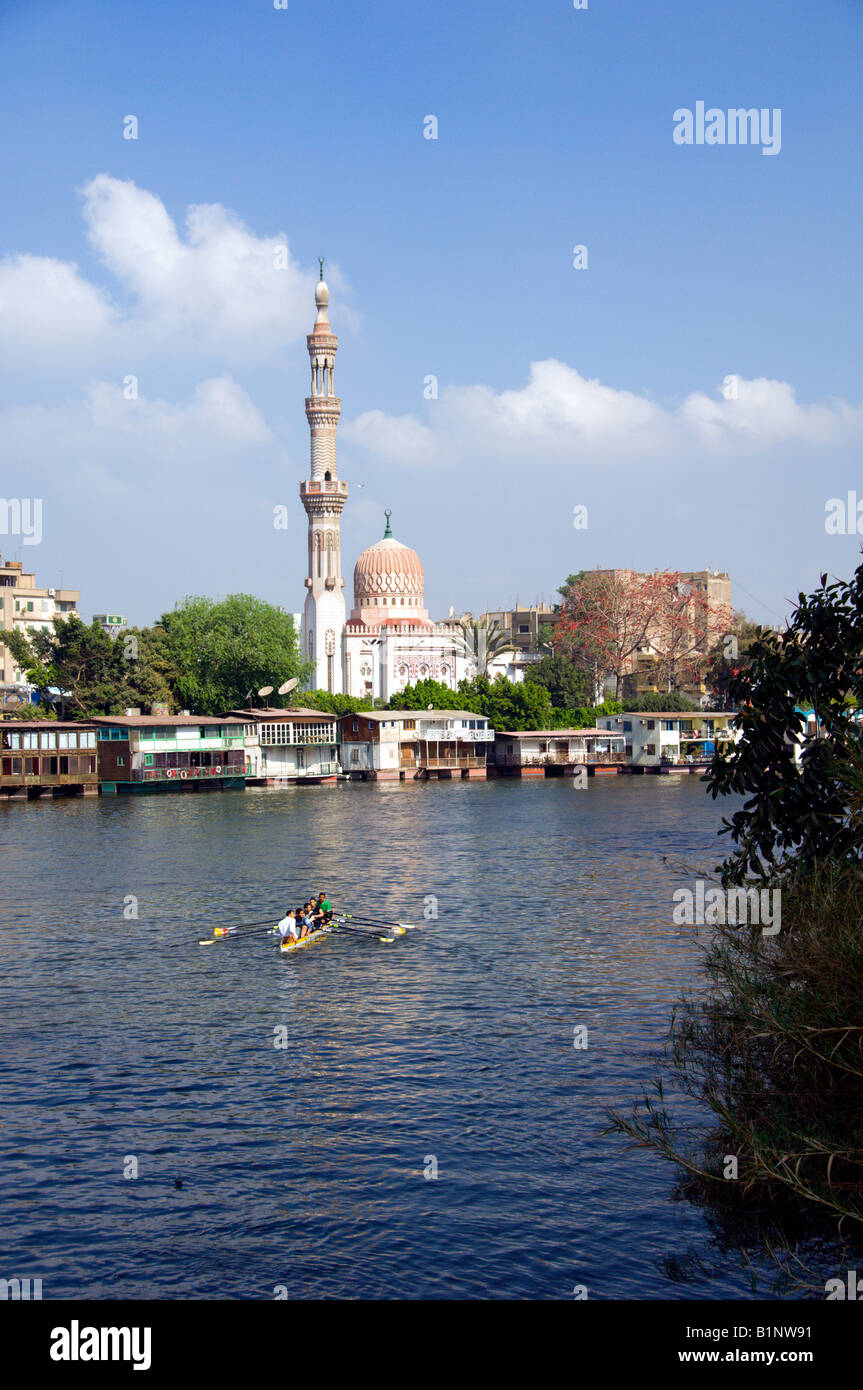 A rowing boat or shell in the Nile River with a mosque in Cairo Egypt ...