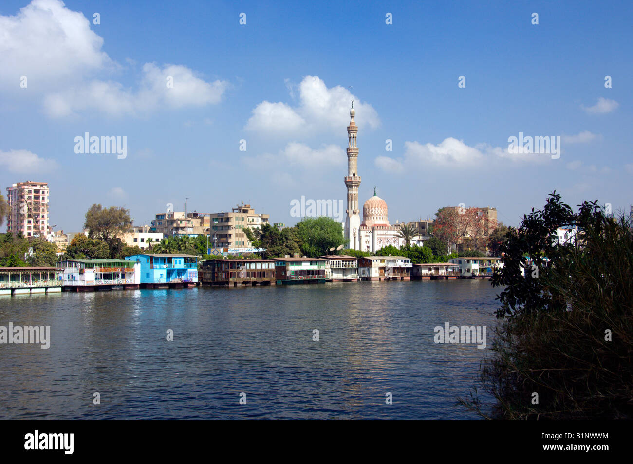 The Nile River with riverboats and mosque in Cairo Egypt Stock Photo ...