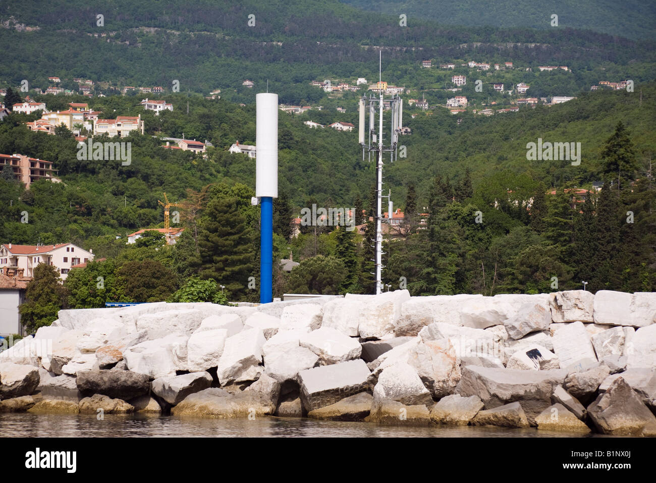 Icici Istria Croatia Europe Mobile phone masts on sea wall Stock Photo ...