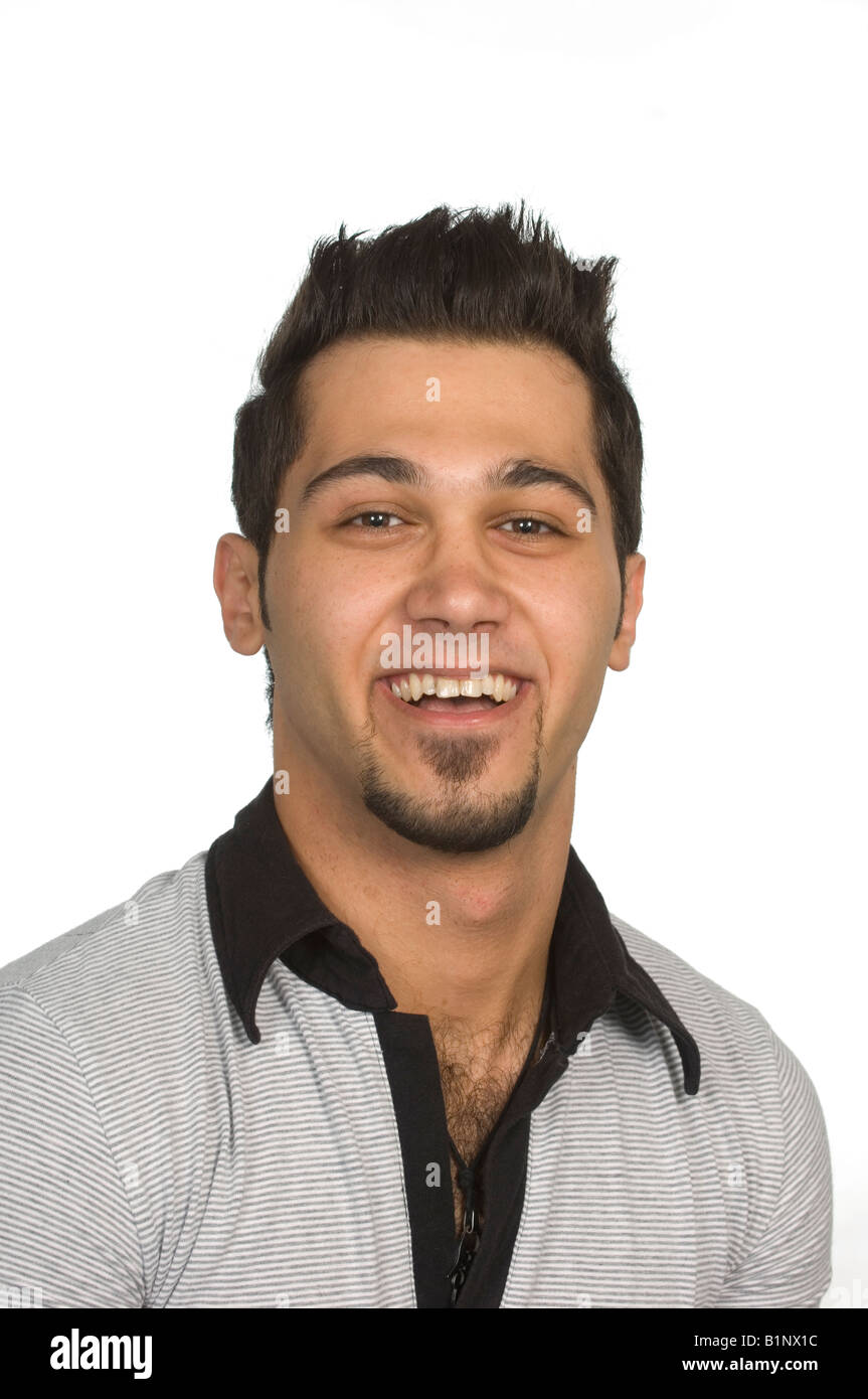 Portrait of a young man laughing against a white background Stock Photo ...