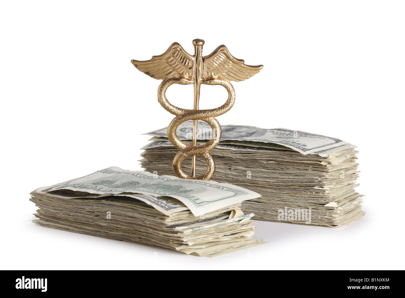 Medical concept caduceus and stack of money cut out on white background ...