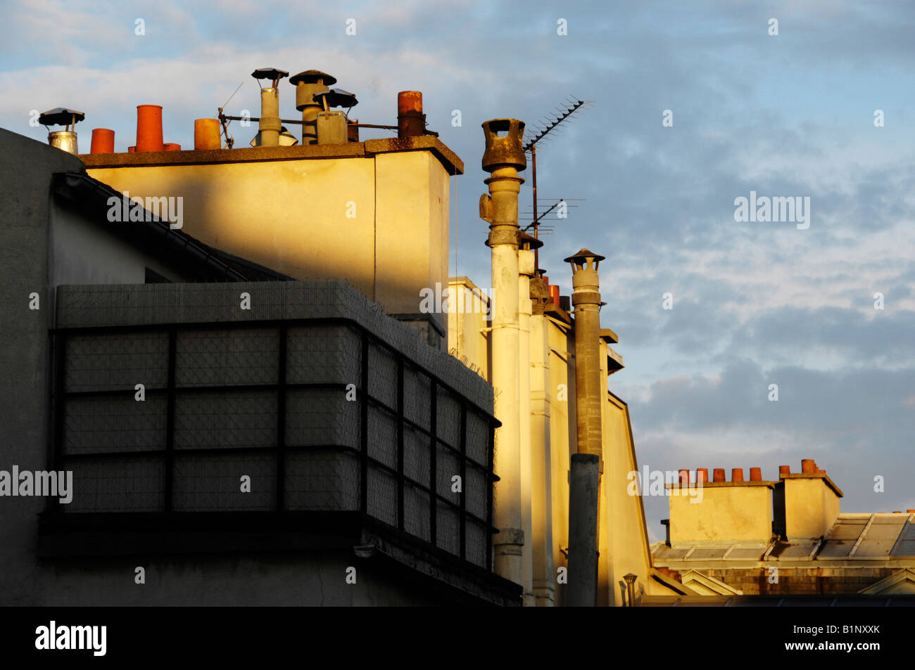 Sky, chimneys and rooftops in Paris Stock Photo - Alamy