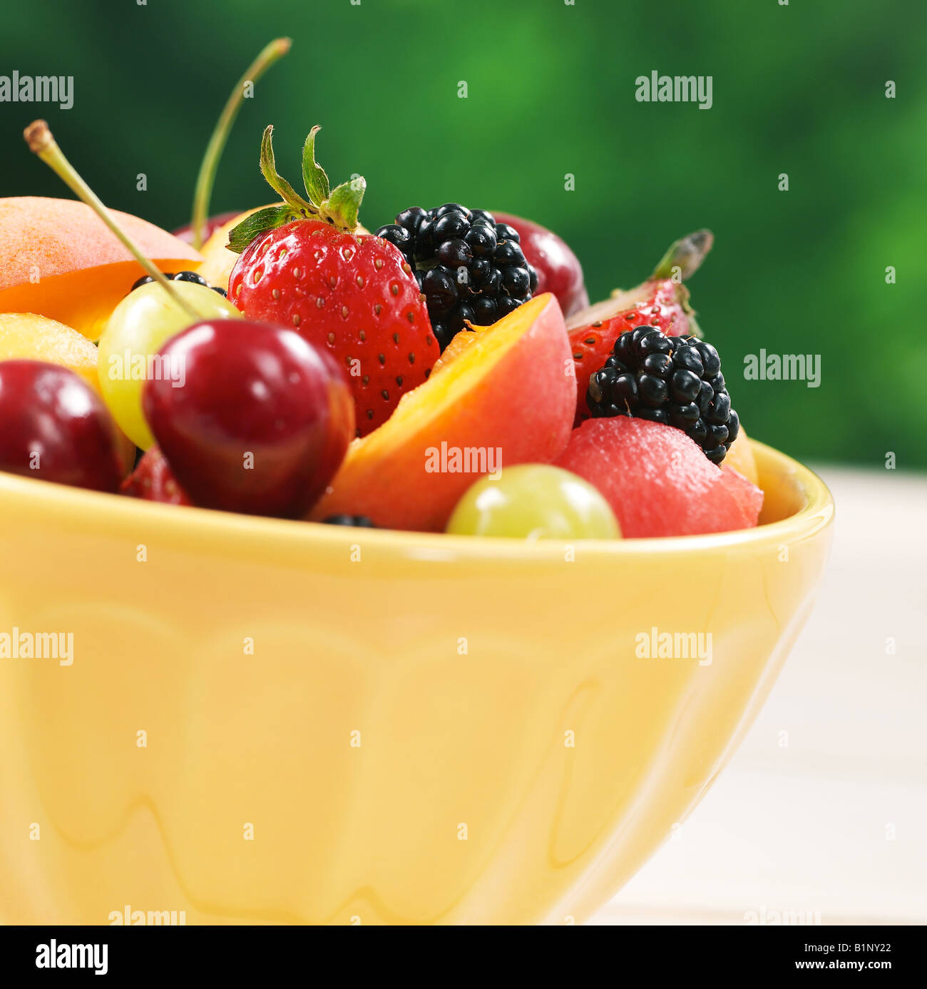 Studio shot of a bowl of mixed fruit in an environment Stock Photo - Alamy