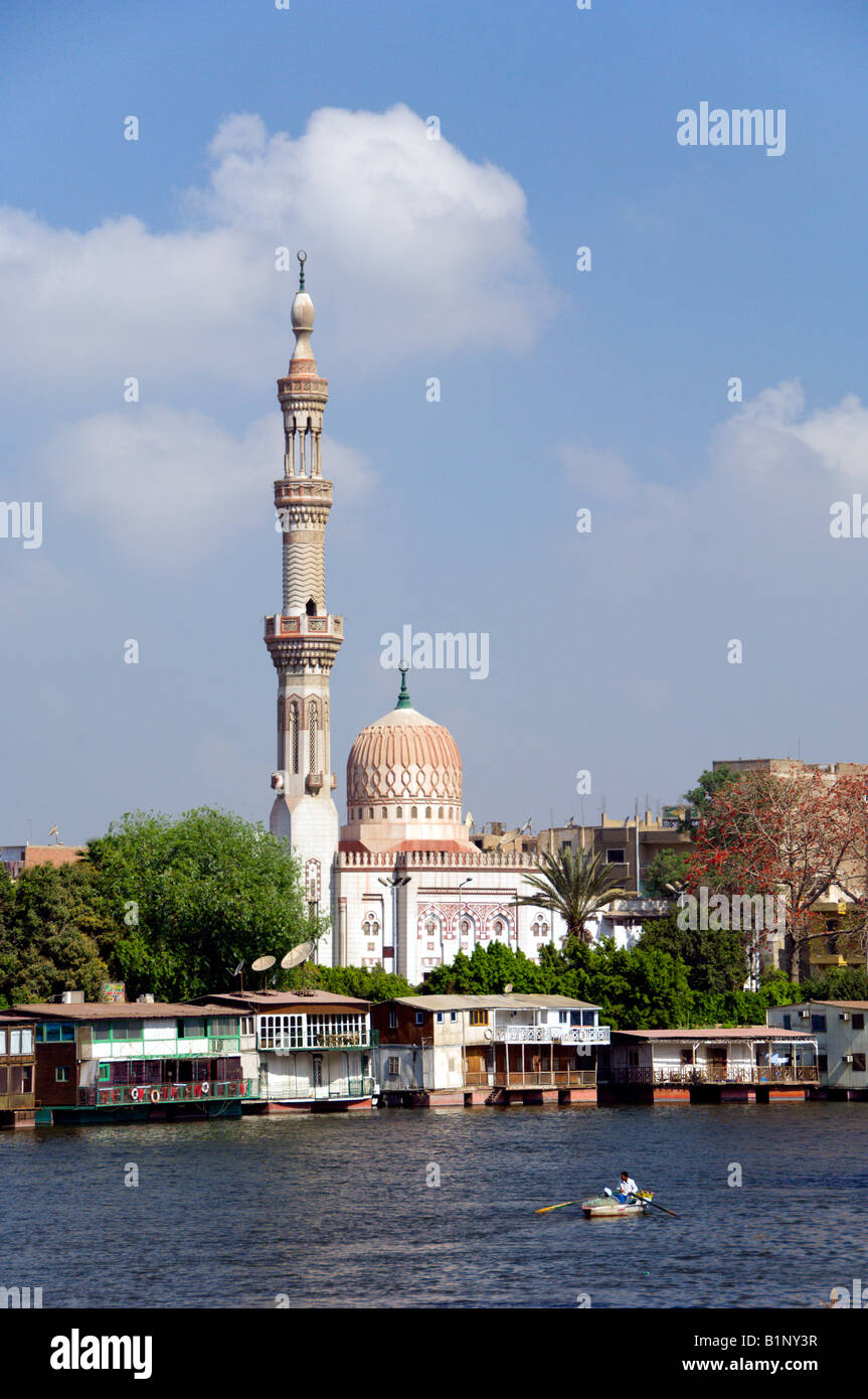 The Nile River with riverboats and a mosque in Cairo Egypt Stock Photo ...