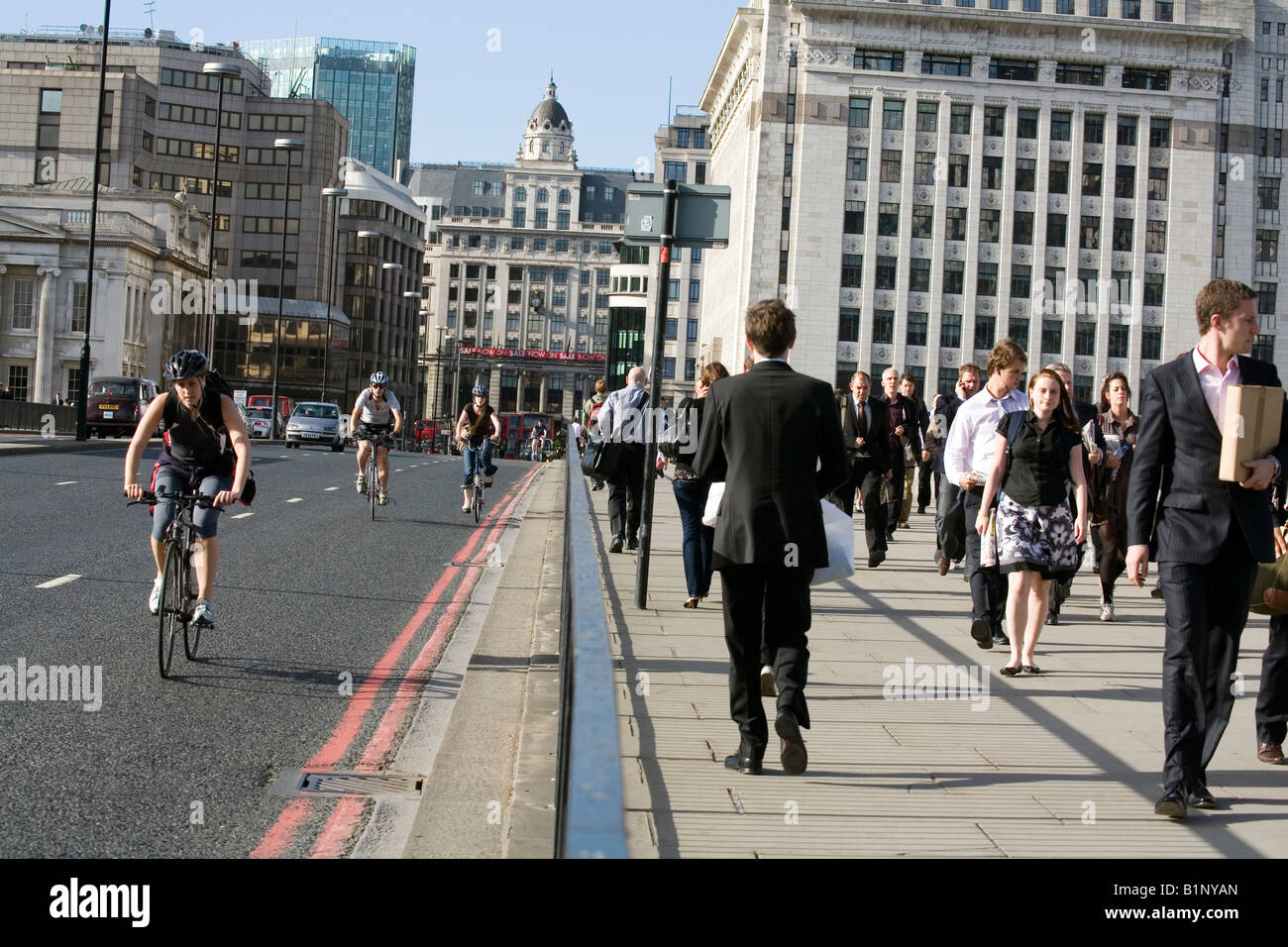 People crossing London bridge at rush hours London England Britain UK ...