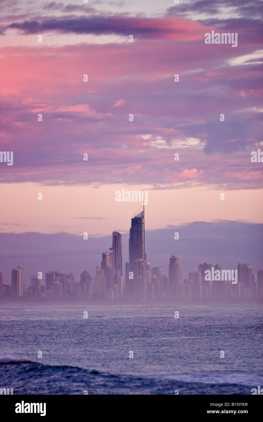 Distant view of skyline across ocean at sunrise, Surfers Paradise, Gold ...