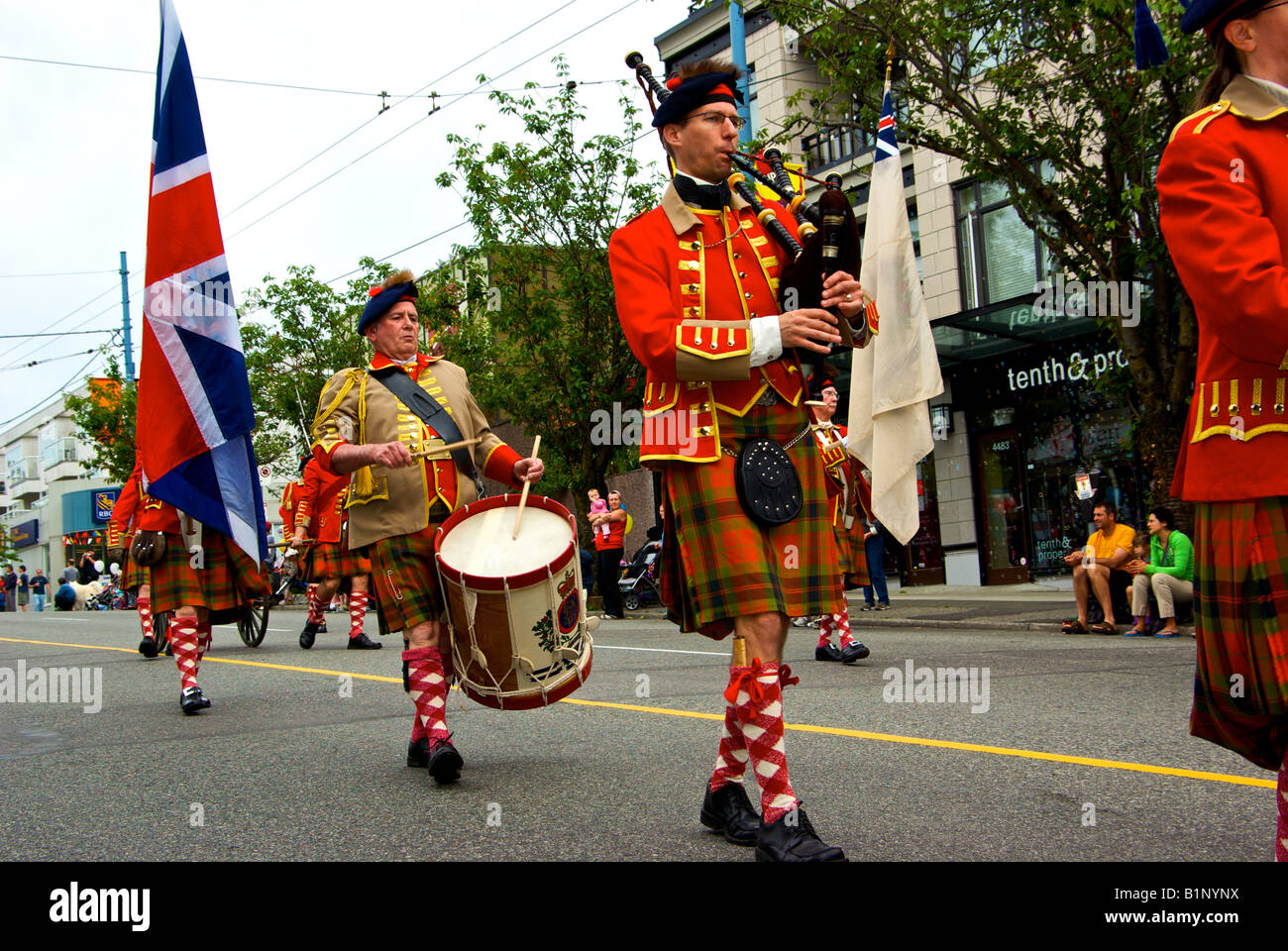 Bag pipe marching band with ceremonial drummer at Point Grey Fiesta Day ...