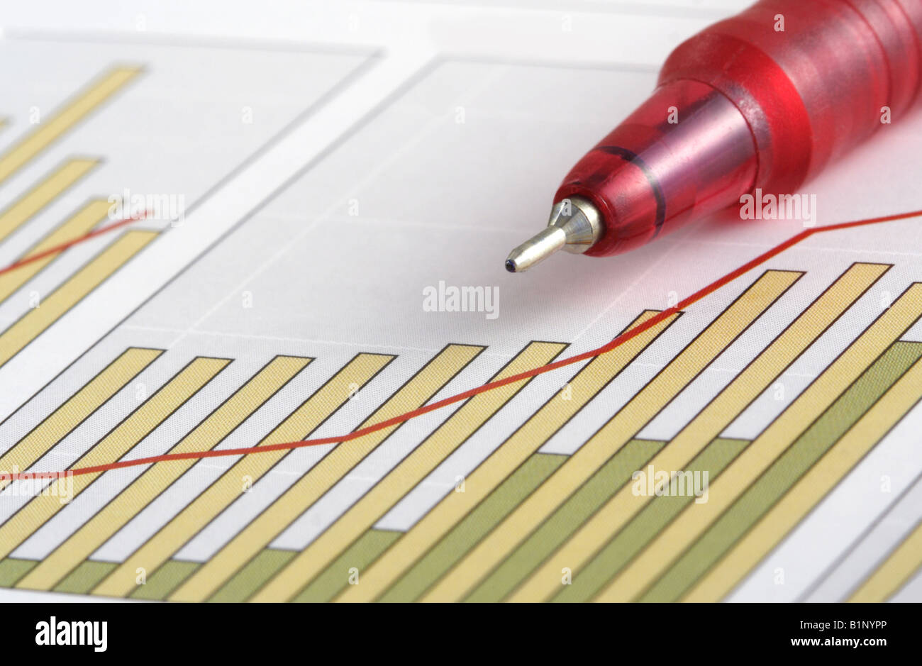 Pen on Positive Earning Chart focus on the tip of the pen Stock Photo ...