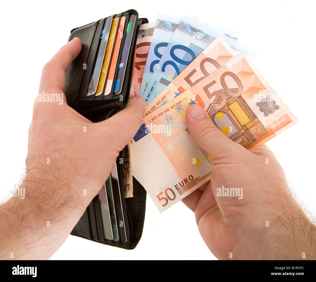 The action of pulling euro out of a wallet isolated on white Stock ...