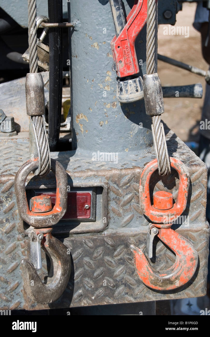 Large hook clasps and cables on back of hollow stem auger drilling rig ...