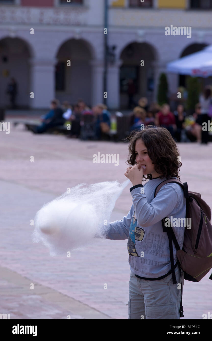 School children enjoy candy floss Marketplace Old Town Zamosc Poland ...