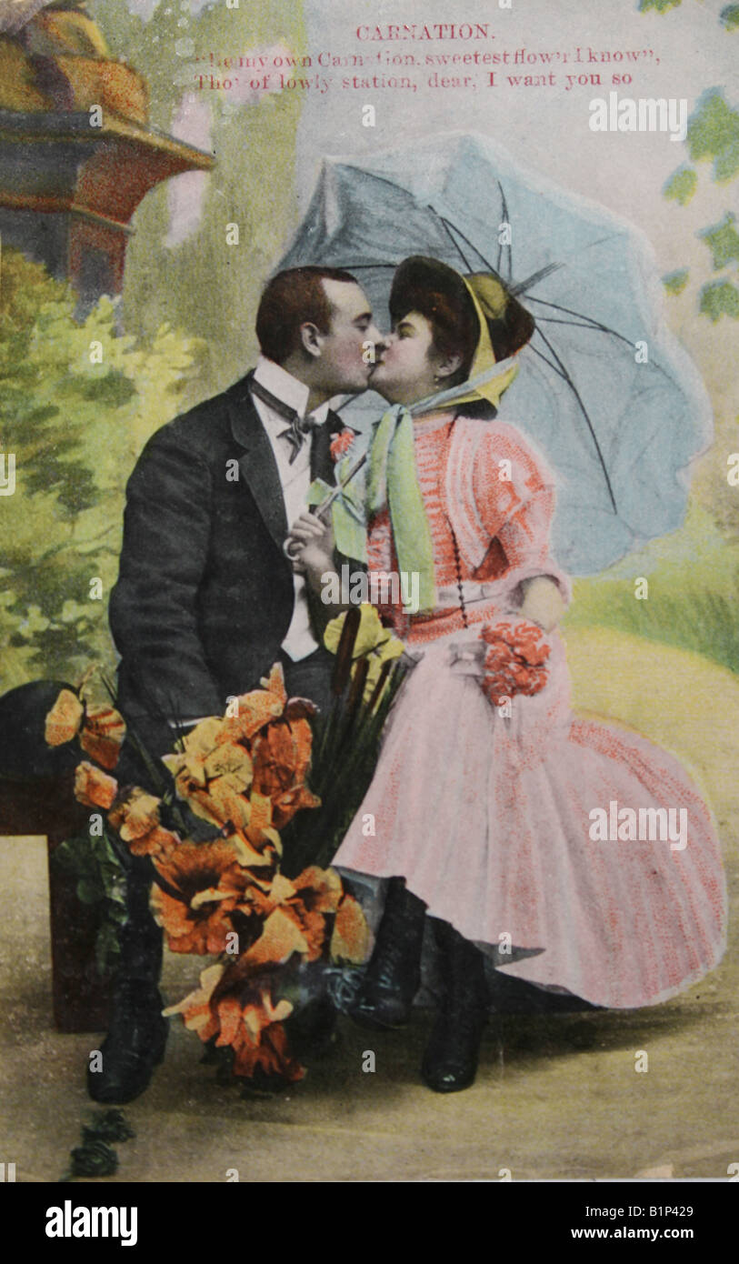 Victorian romance couple kissing under umbrella circa 1904 Stock Photo ...