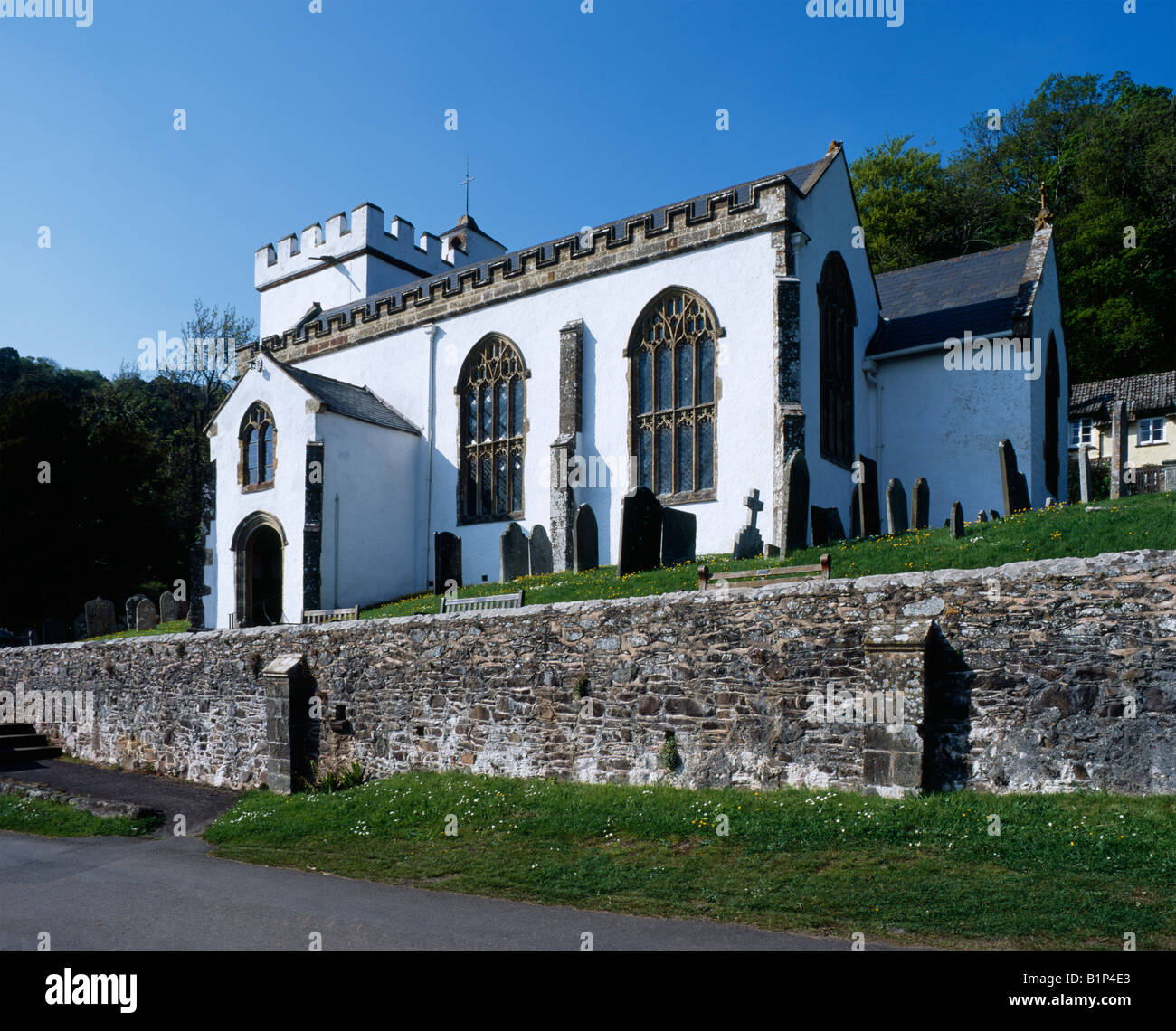 The 15th Century church of All Saints in the National Trust village of ...