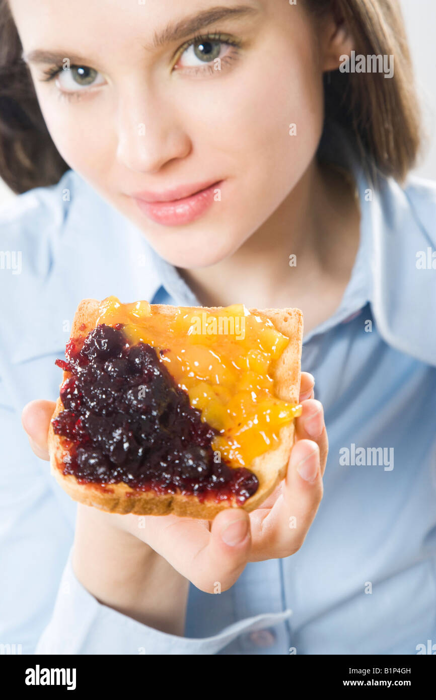 Girl with toast Stock Photo - Alamy
