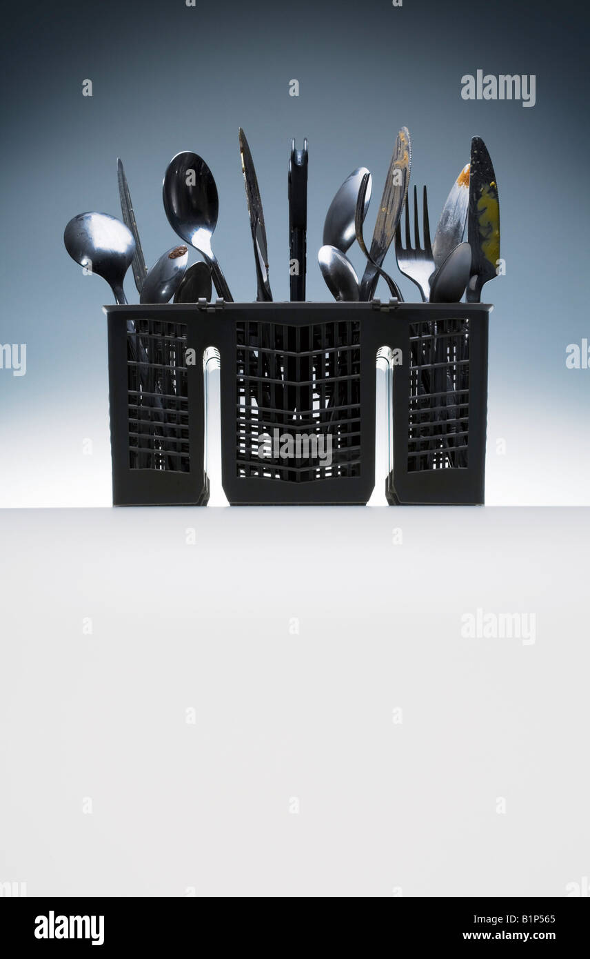Dirty Cutlery in Dishwasher Rack Stock Photo - Alamy