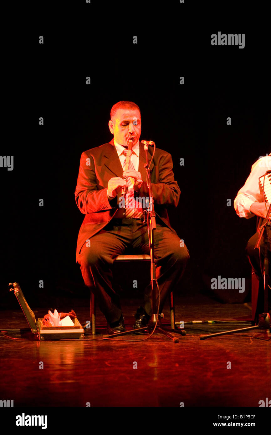 Egyptian musician playing a wind instrument Stock Photo - Alamy