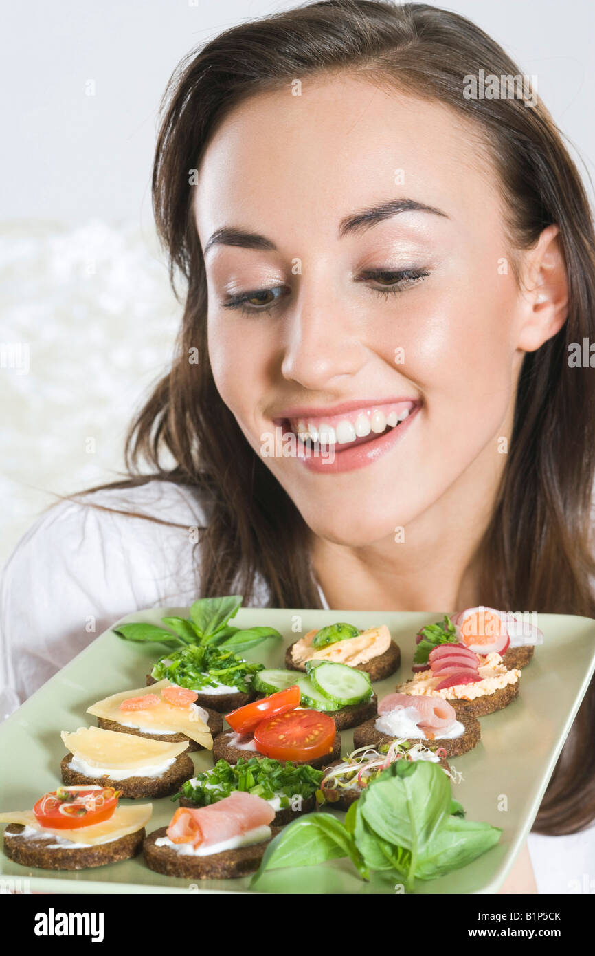 Young woman with several sandwiches Stock Photo - Alamy