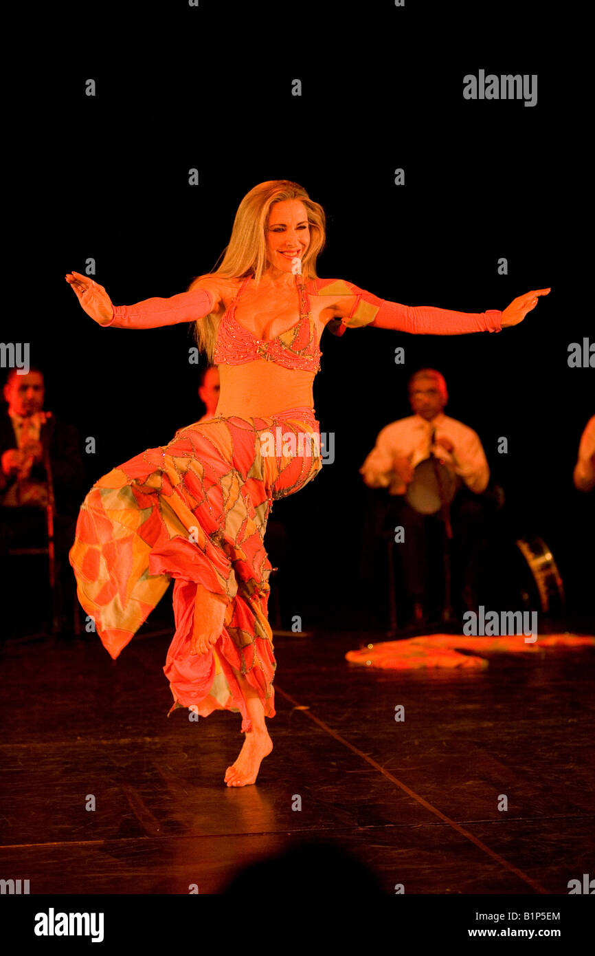 Egyptian Belly dancer in a pink costume dancing with a band Stock Photo ...