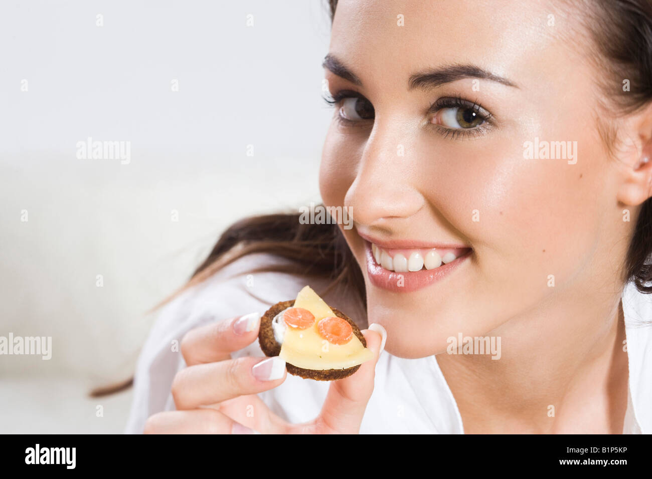 Young woman eating cherry model hi-res stock photography and images - Alamy