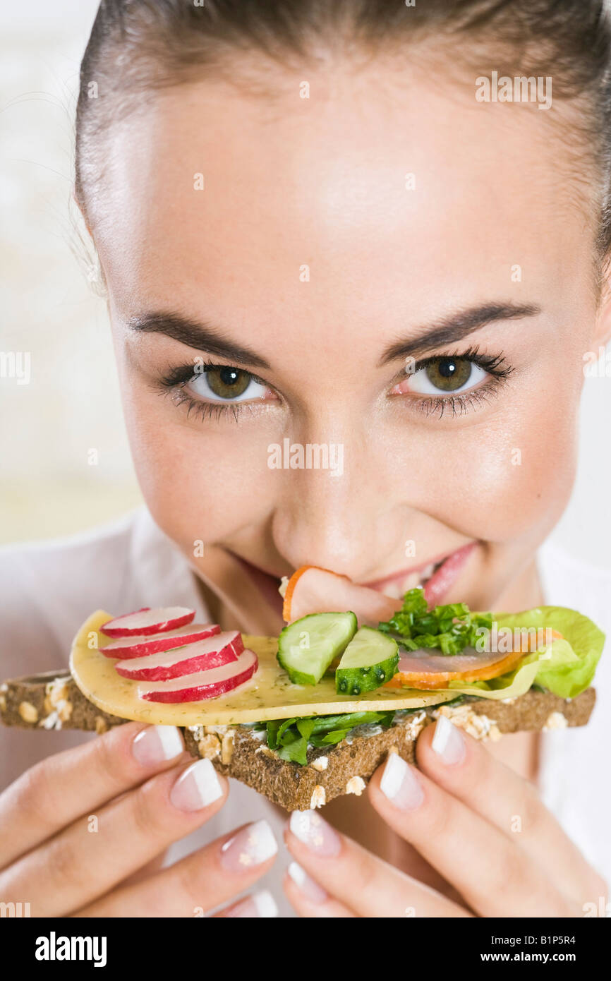 Young woman with sandwich Stock Photo - Alamy
