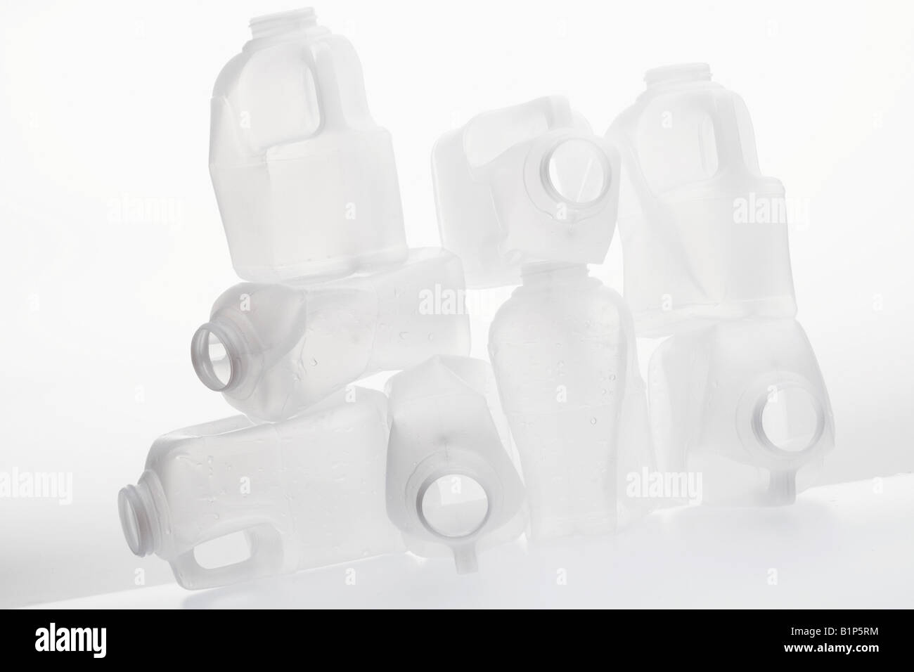 Empty Plastic Milk Bottles Stock Photo - Alamy