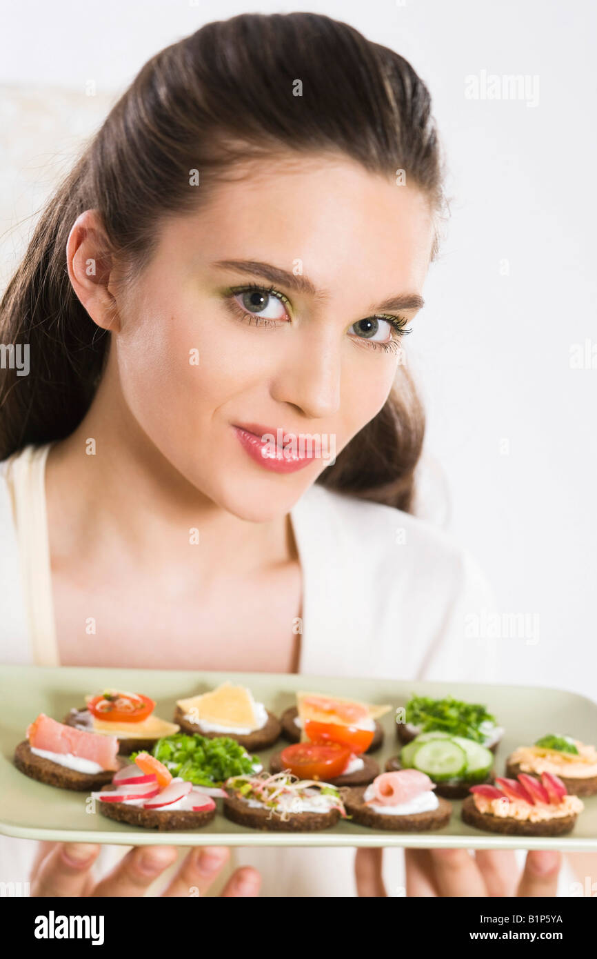 Young woman with several sandwiches Stock Photo - Alamy
