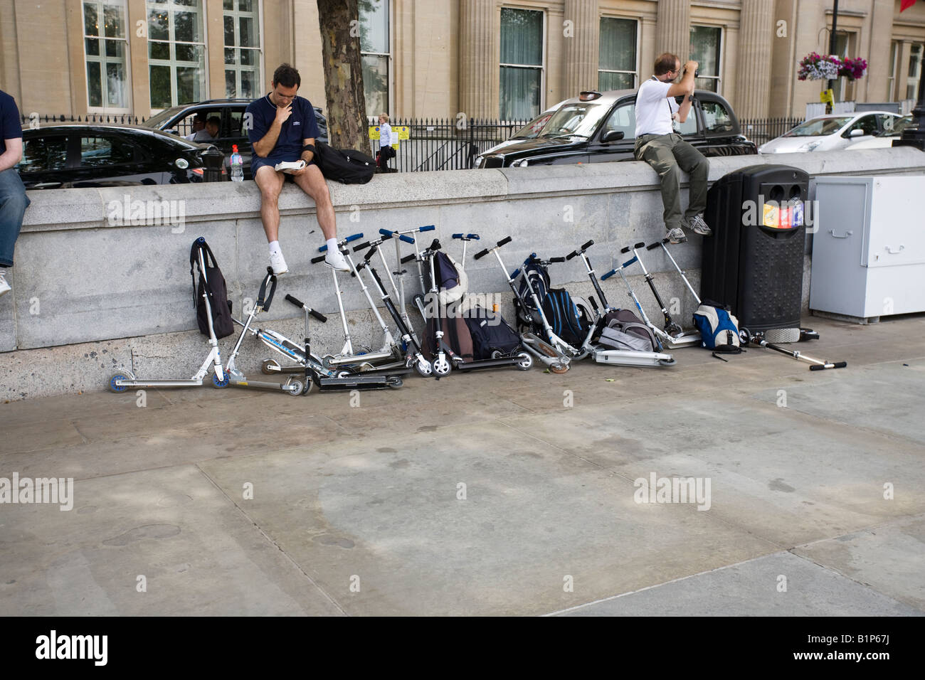 trafalger square london scooters Stock Photo - Alamy