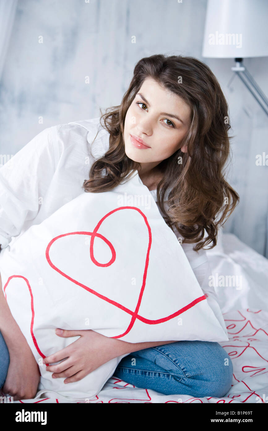 Woman with pillow Stock Photo - Alamy