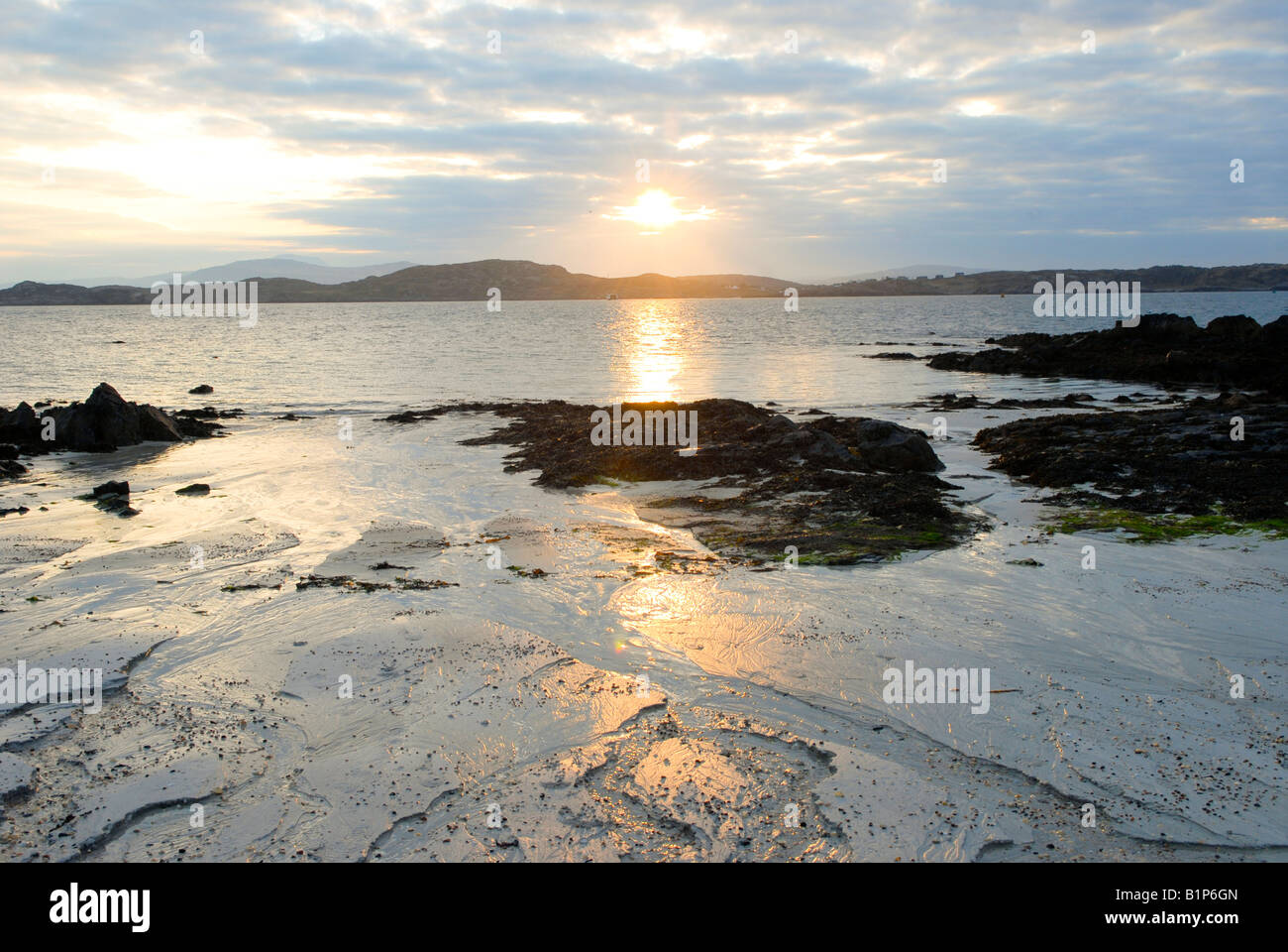 Iona Sunrise on horizon early morning Stock Photo - Alamy