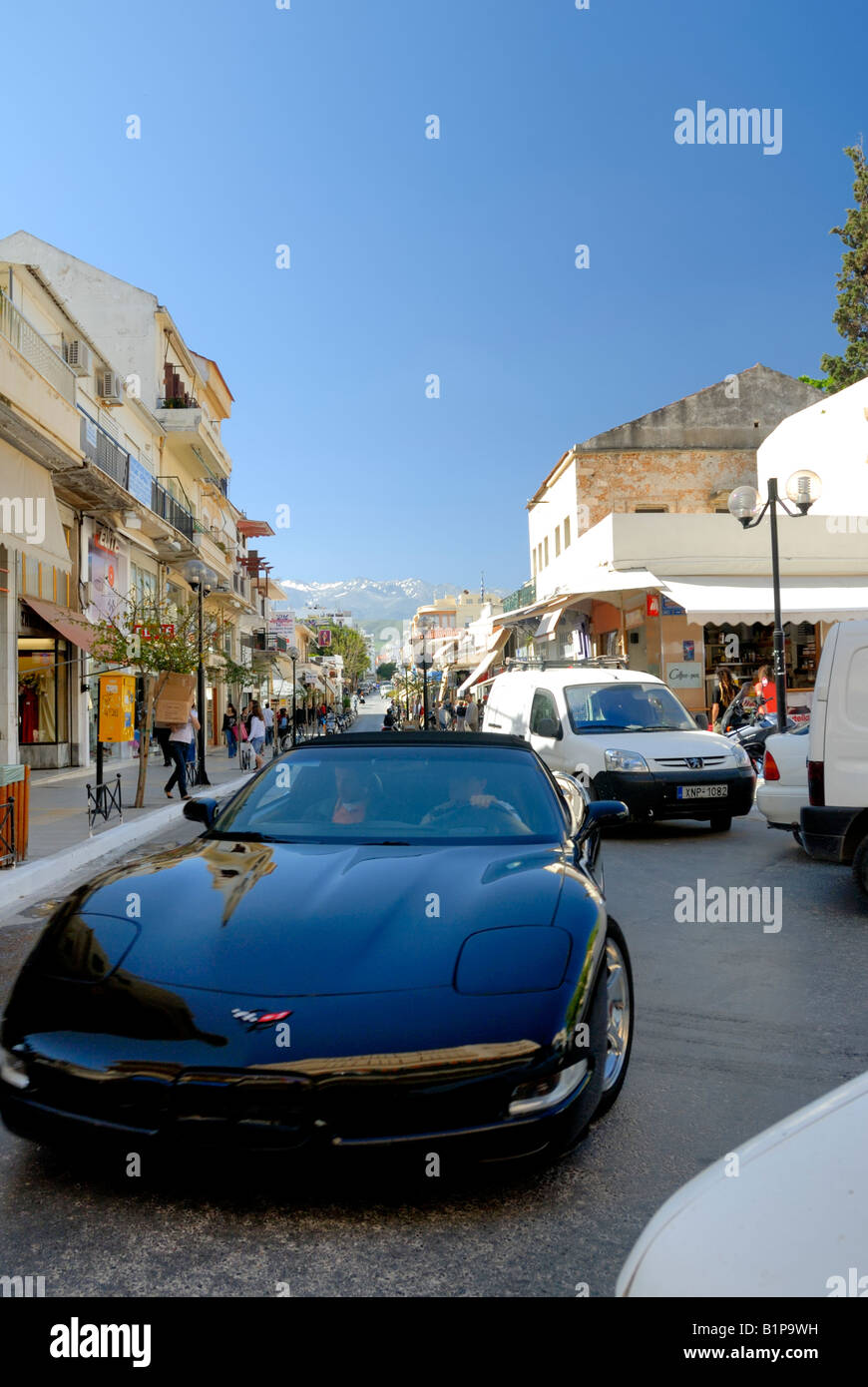 Chania street view and snowy, white, mountains Lefka Ori, Crete, Greece ...
