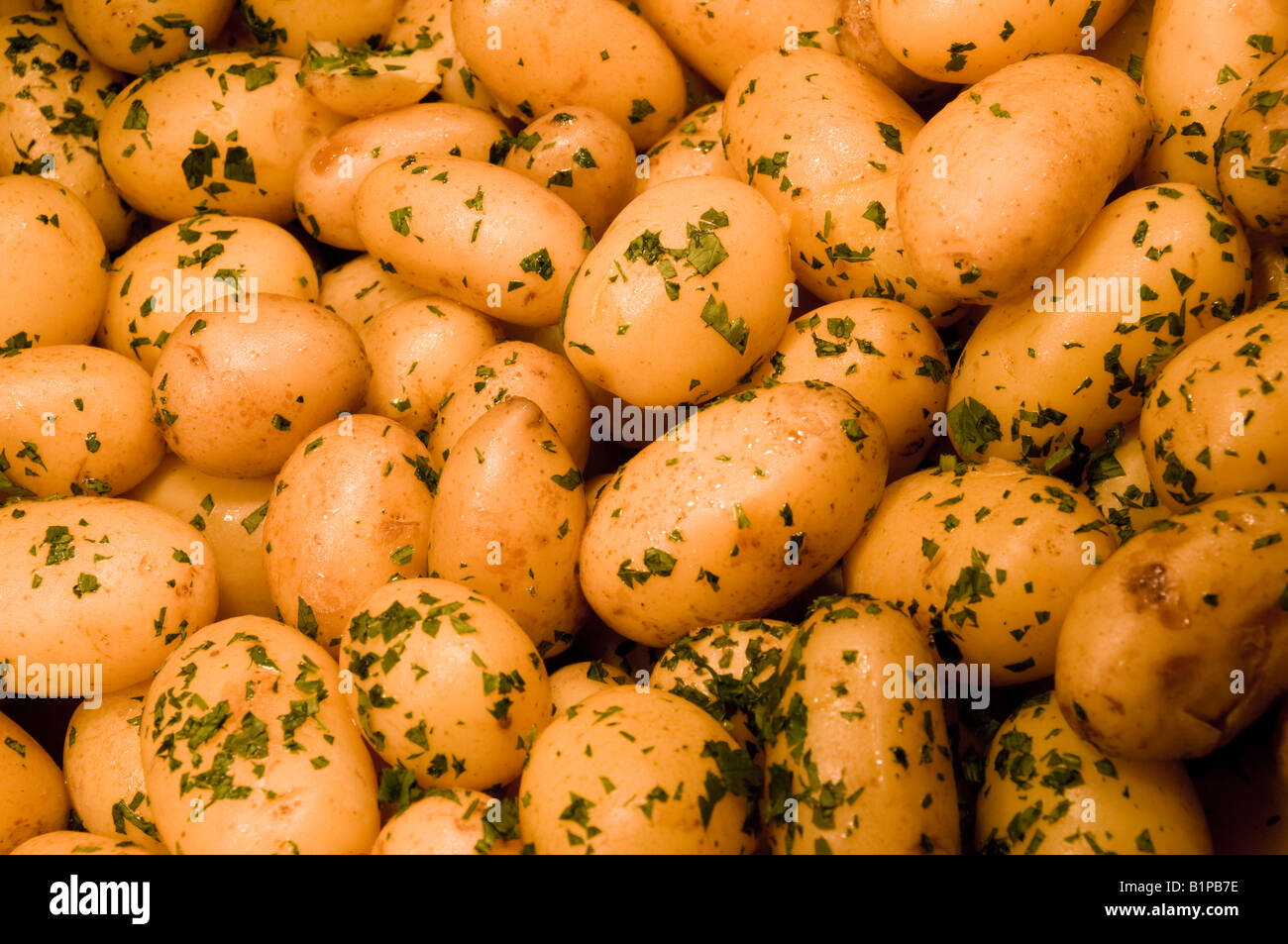 Boiled new potatoes with mint Stock Photo - Alamy