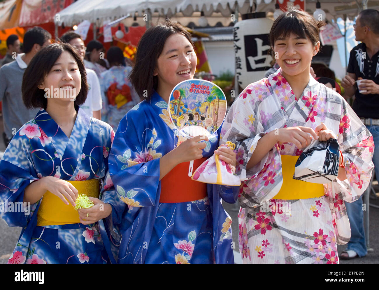 Three young girls dressed in summer cotton yukata robes enjoying the ...