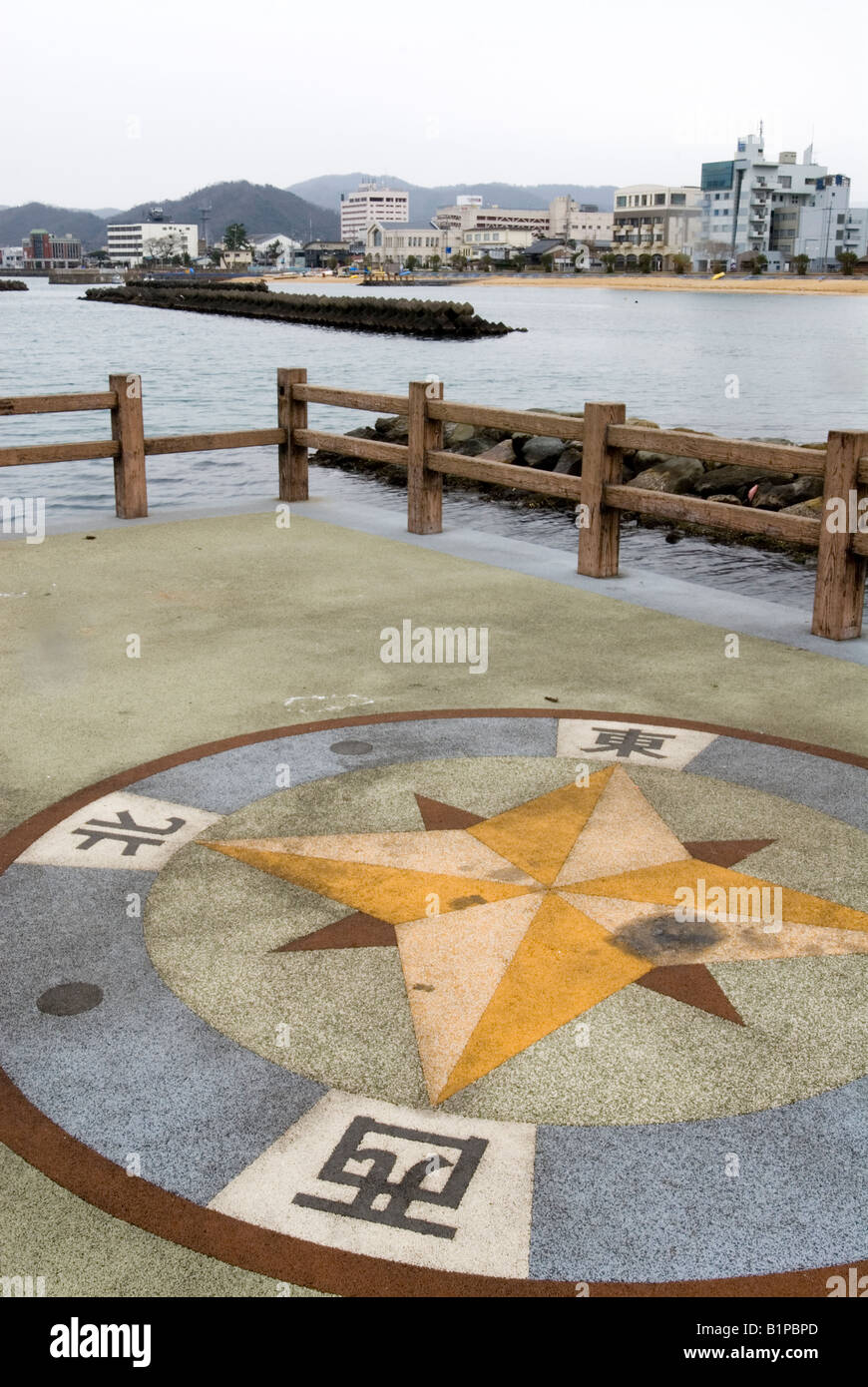 Compass at waterfront park in downtown Obama City, Japan Stock Photo ...