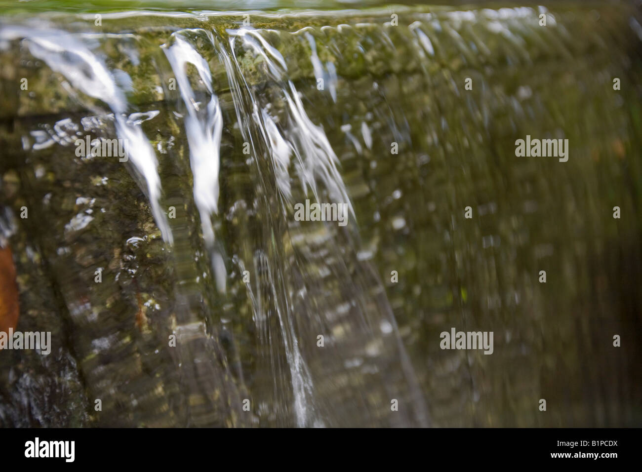 Running water in a water feature in Holker Gardens Cumbria UK Stock ...