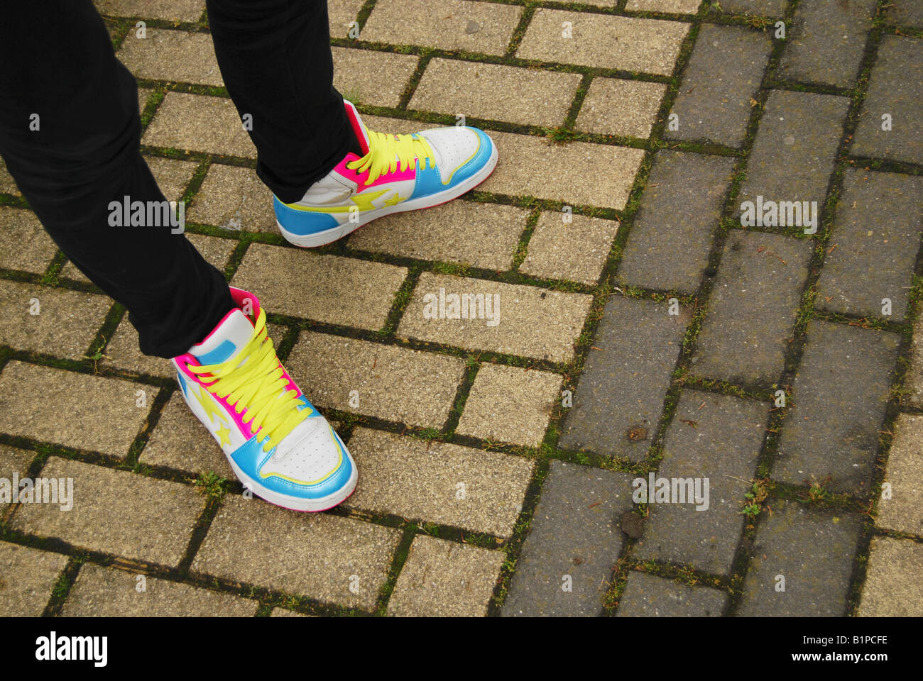 fancy trainers worn by adolescent girl Stock Photo - Alamy