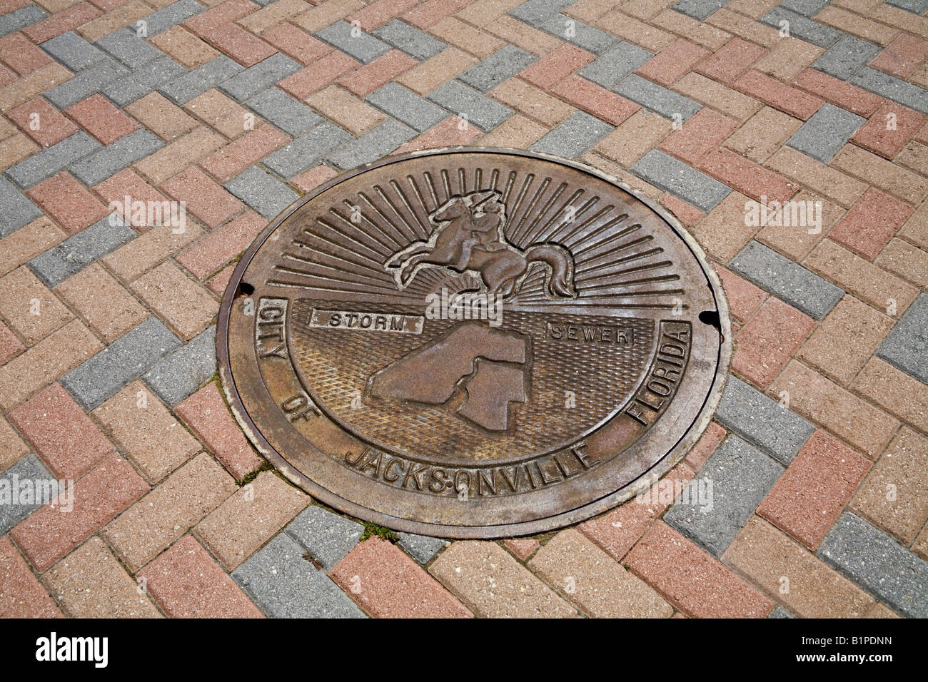 Storm sewer manhole cover in Jacksonville Florida Stock Photo - Alamy