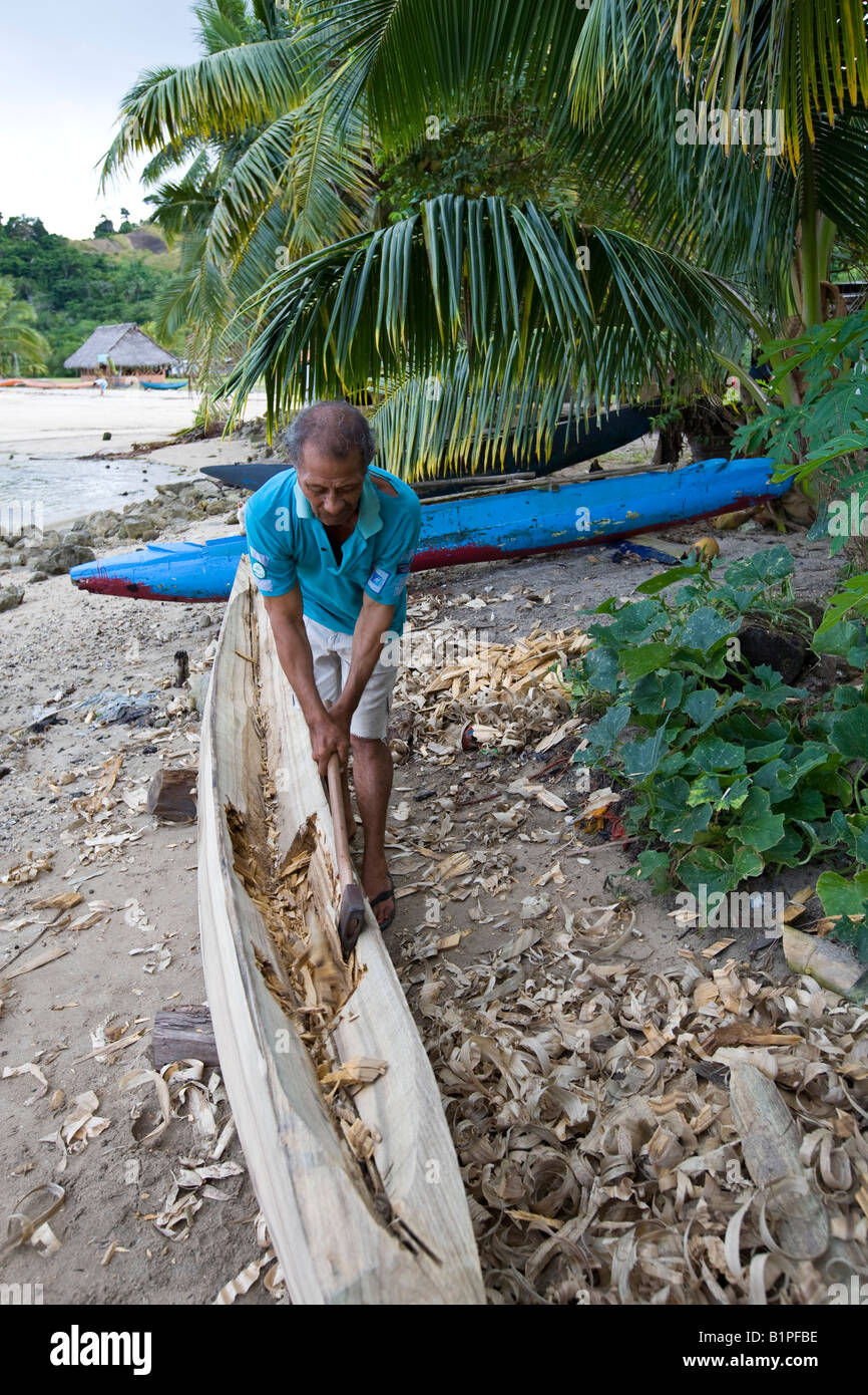 Man building Outrigger canoe Kioa Island Fiji Stock Photo - Alamy