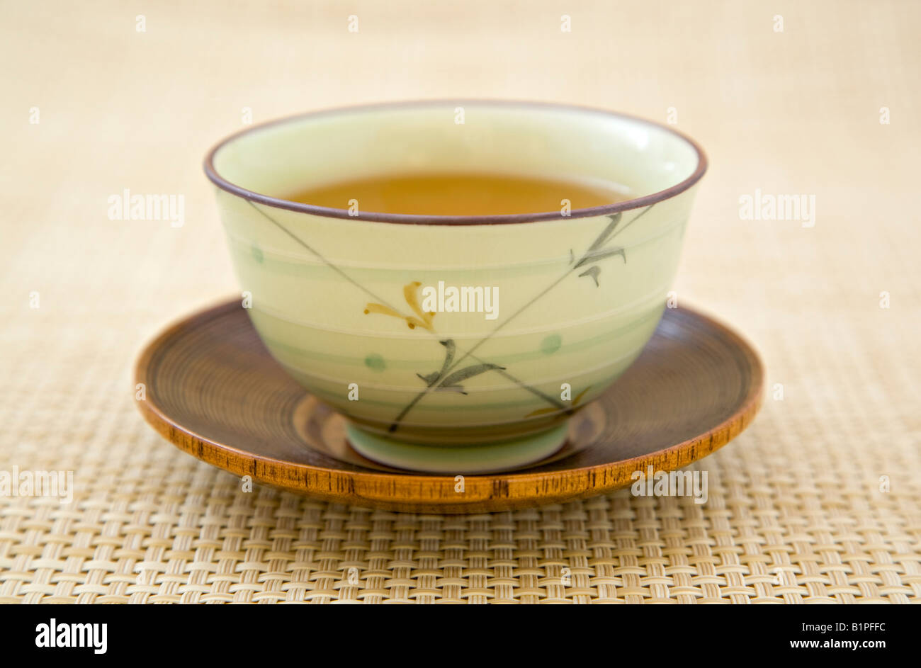 Single Japanese style tea cup filled with tea Stock Photo - Alamy