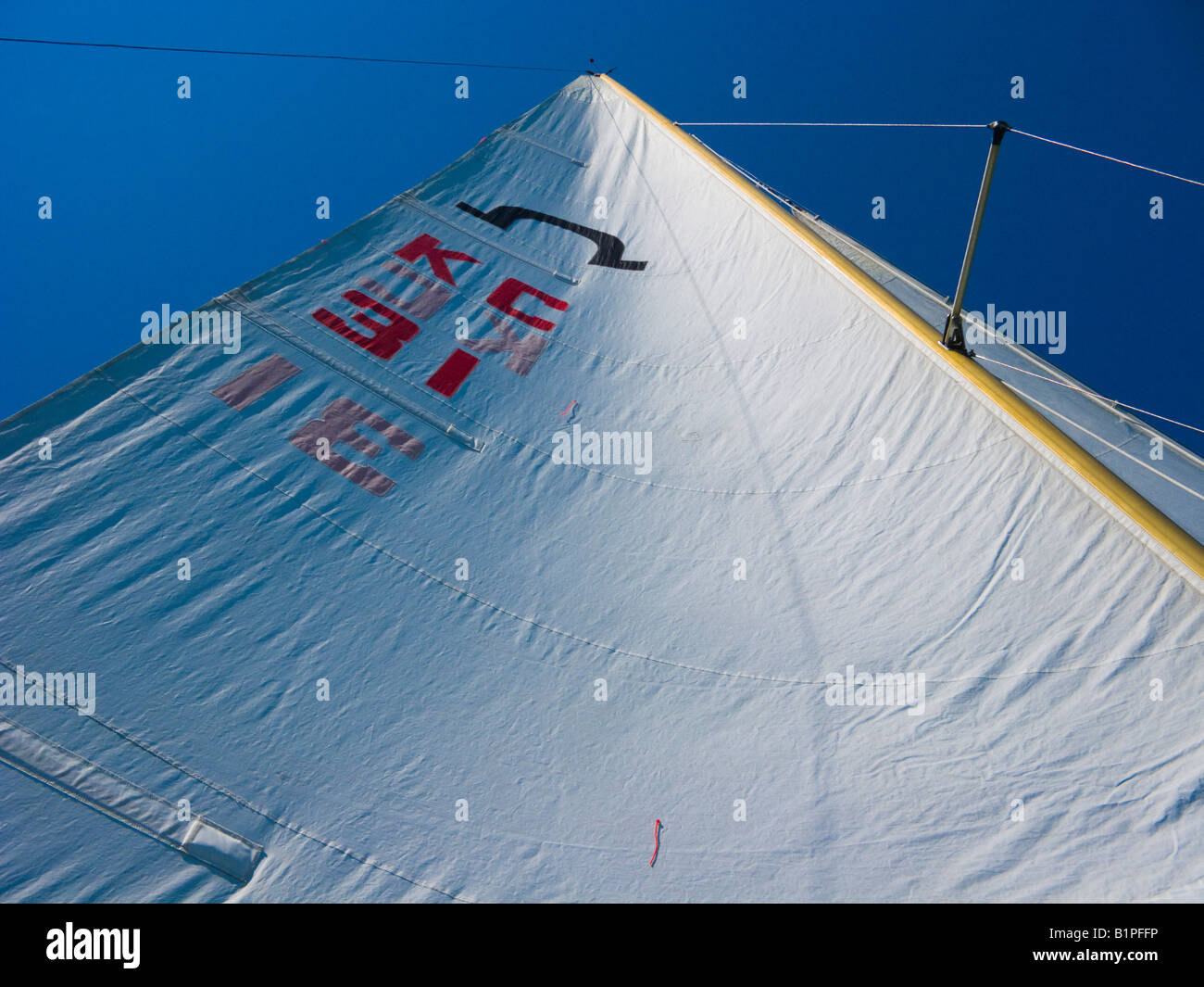 Looking up the mast and main sail of a Soling class sailboat Stock ...