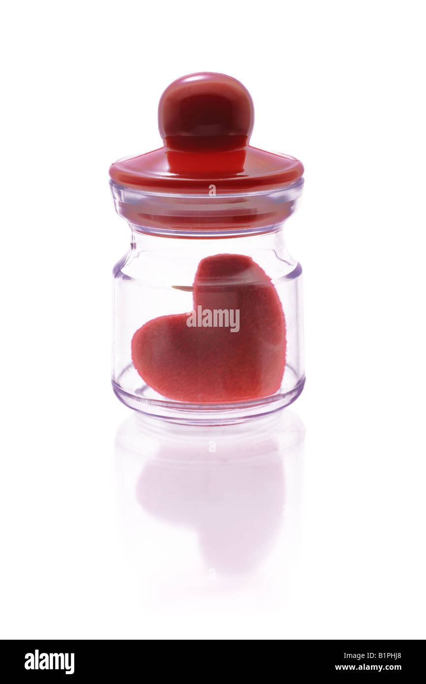 Love heart symbol inside mini container on white background Stock Photo ...