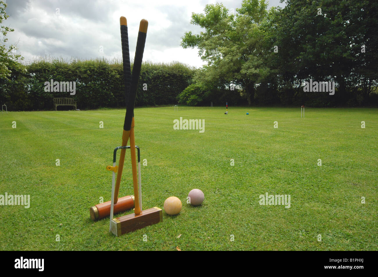 Croquet mallets, ball on lawn Stock Photo - Alamy