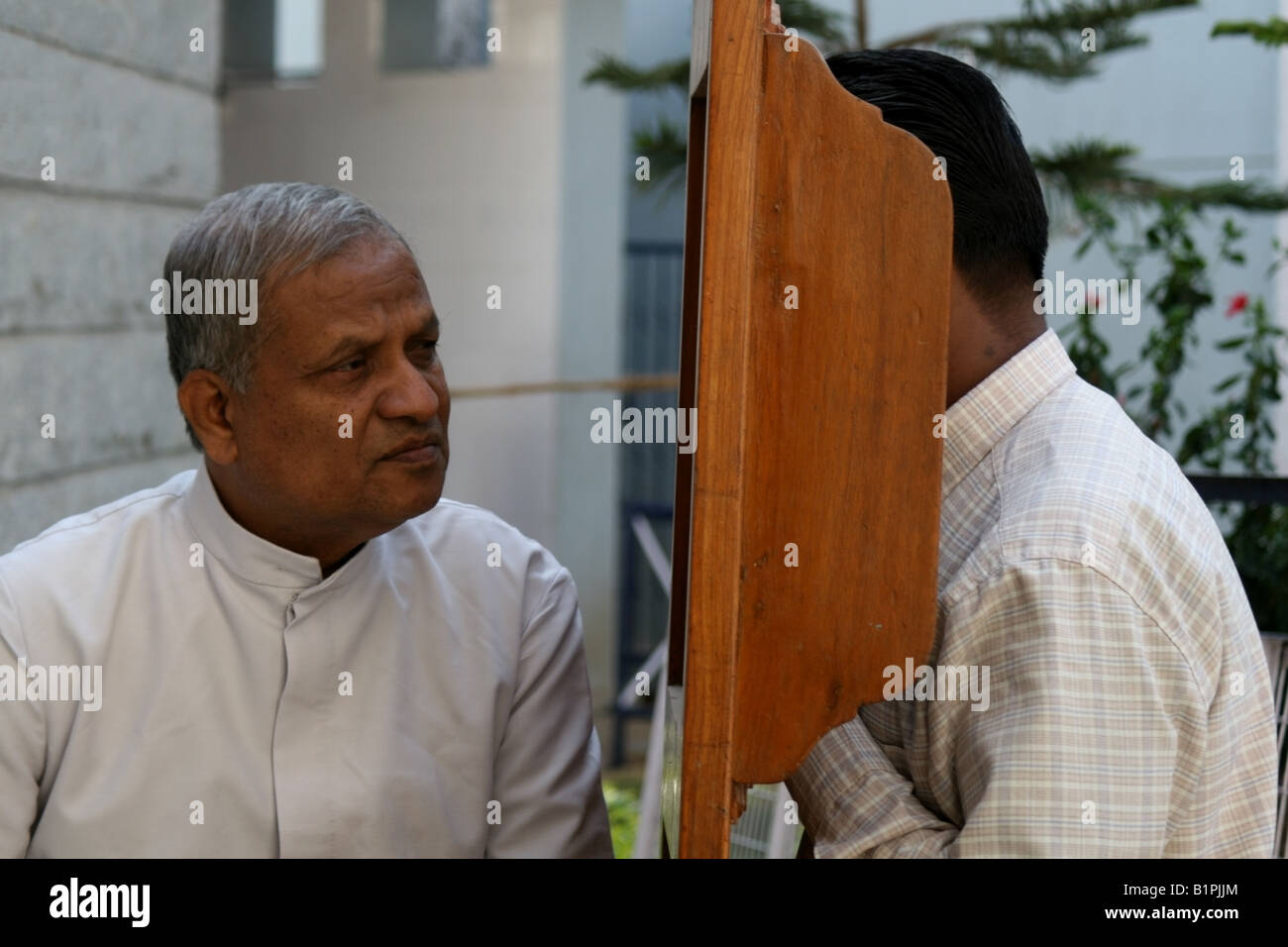 Catholic priest confession hi-res stock photography and images - Alamy