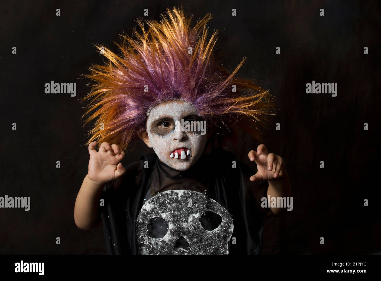 Head and shoulder portrait of a 3 years old boy wearing a scary ...
